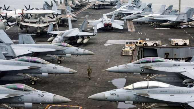 Inside the sprawling USS Abraham Lincoln, bombers swarm as Trump ...